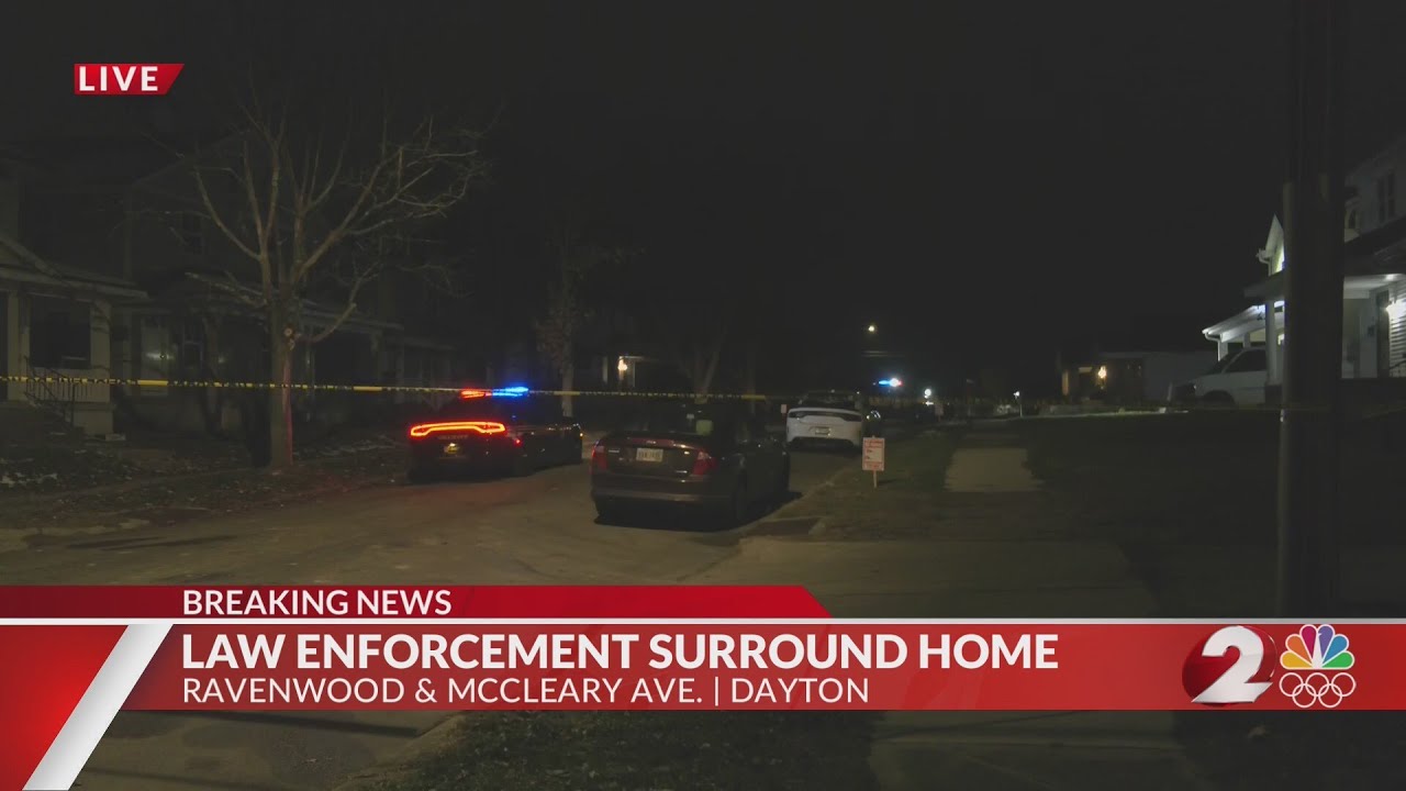 Law enforcement surround home - YouTube
