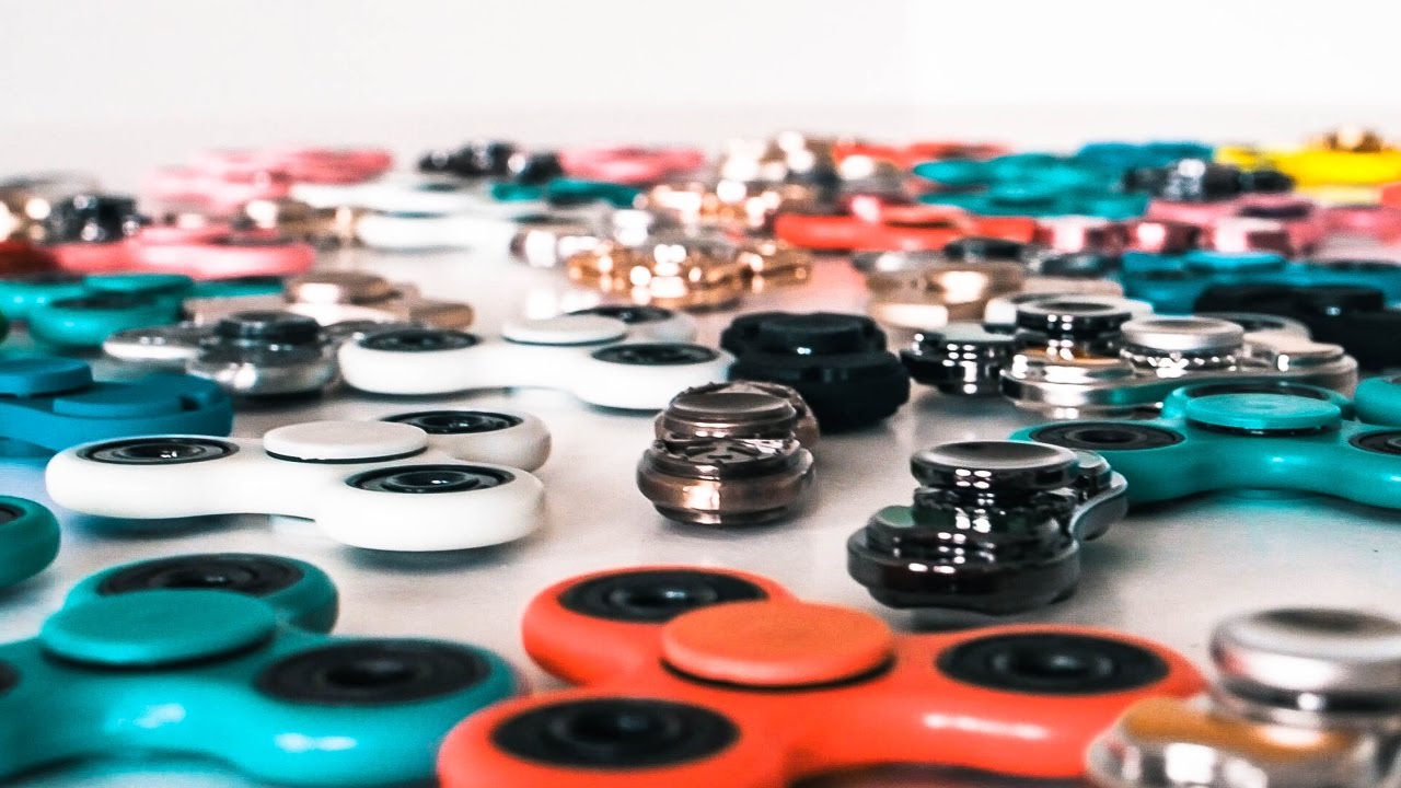 SPINNING 100 FIDGET SPINNERS AT ONCE - YouTube