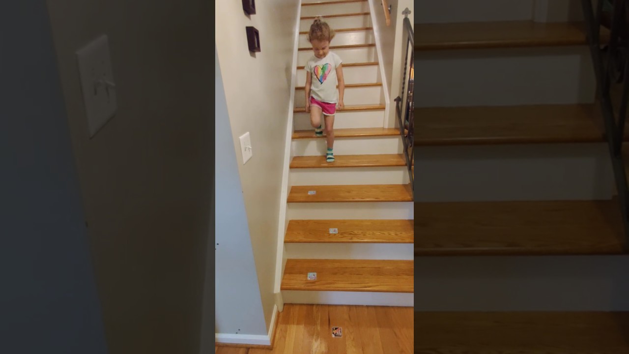 Stair navigation: Descending reciprocally (one foot per step) with ...