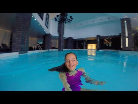 Swimming underwater in an indoor swimming pool
