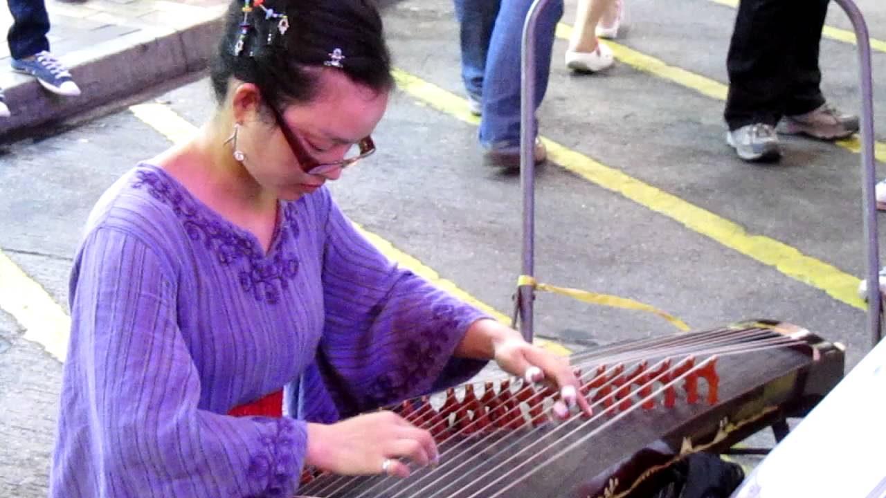 Young Lady Playing Traditional Chinese Musical Instrument - Mong Kok HK ...