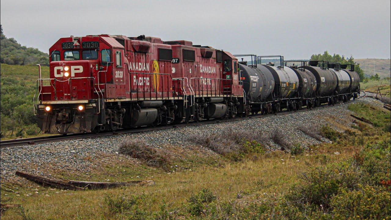 Dual GP38-2's!!!! CP 3030 and CP 3097 lead CP C31 on the Copithorne Spur West of Cochrane - YouTube