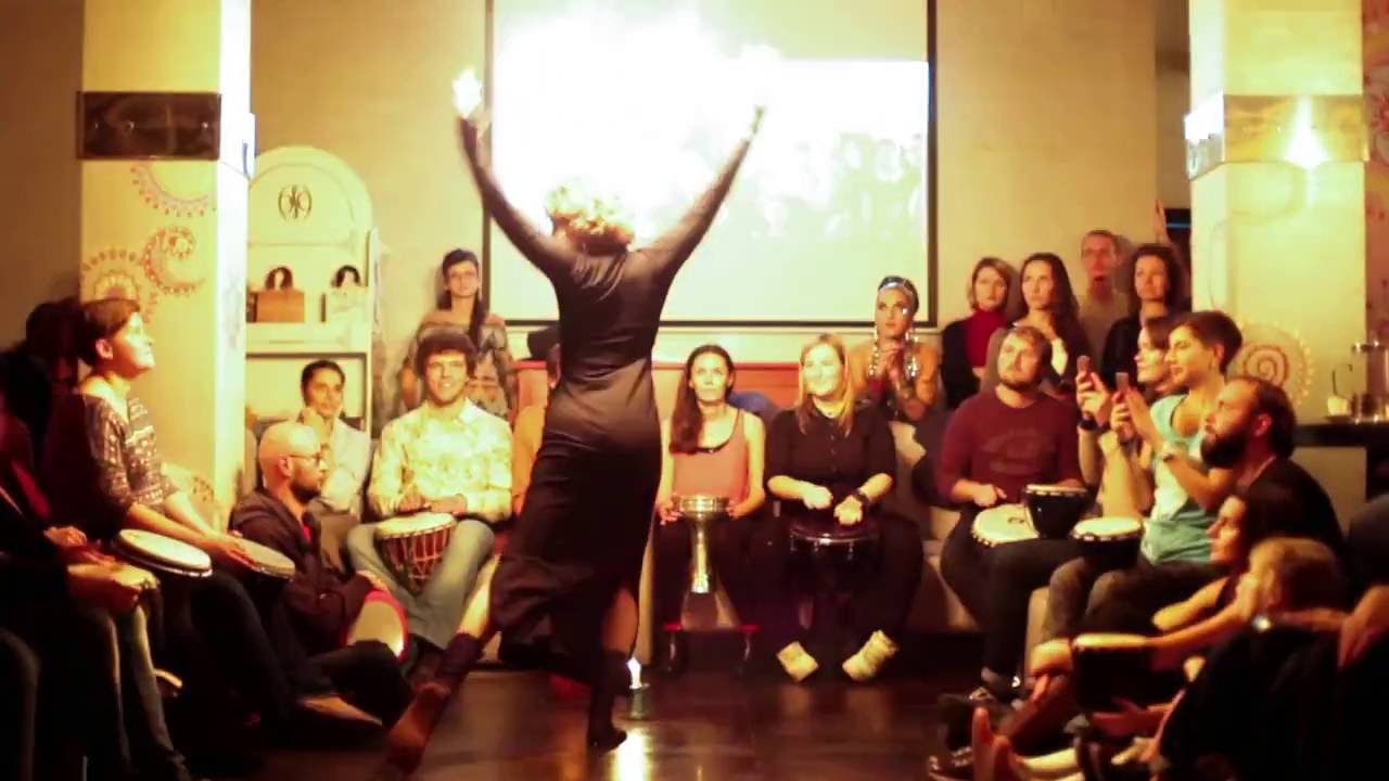 awesome dancing with fire on djembe drum party - YouTube