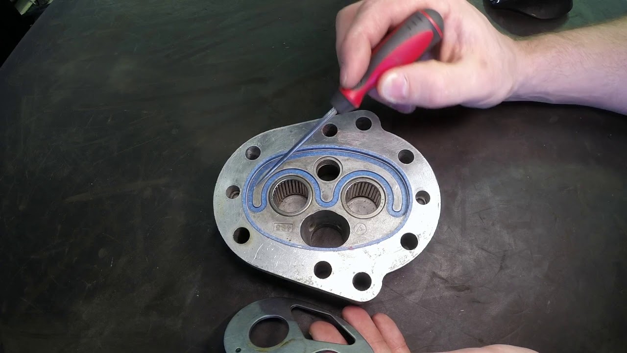 The Function of an External Gear Type Pump Pressure Plate - YouTube