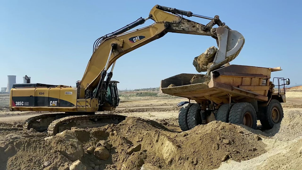 Caterpillar 385C Excavator Loading Caterpillar Dumpers - Interkat SA ...