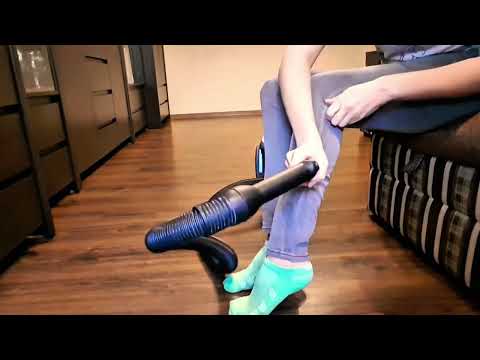 A lady vacuuming her socks, jeans and feet. (1080 60fps to 2160 60fps)