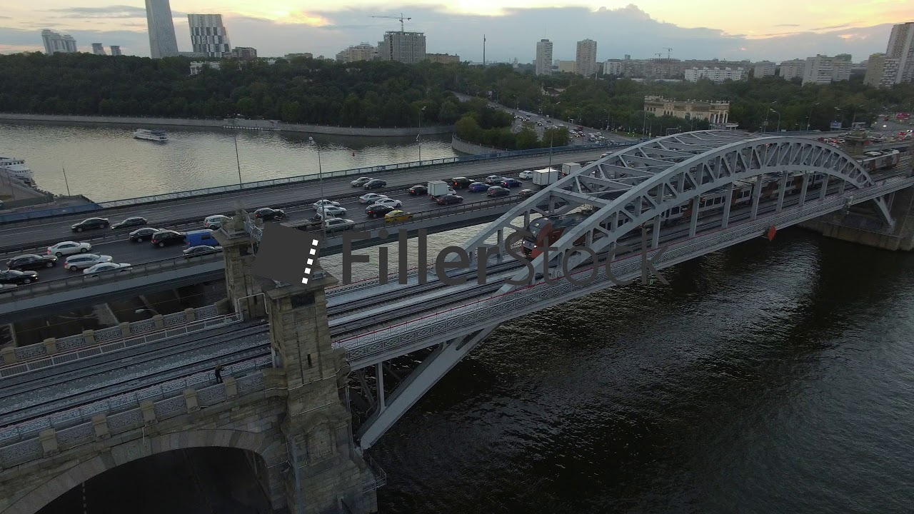 An aerial view of a road bridge and a long highway with busy traffic ...