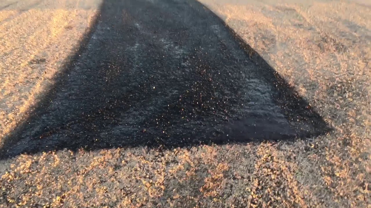 Tar & Chipping a Road - YouTube