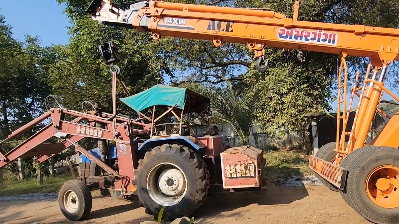 Hydra crane loading tractors on truck | hydra crane & tractor | Tractor ...