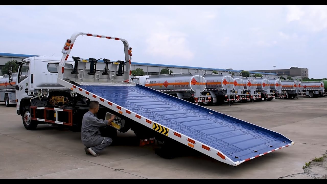 DongFeng wrecker truck load a vehicle onto a flatbed tow truck - YouTube