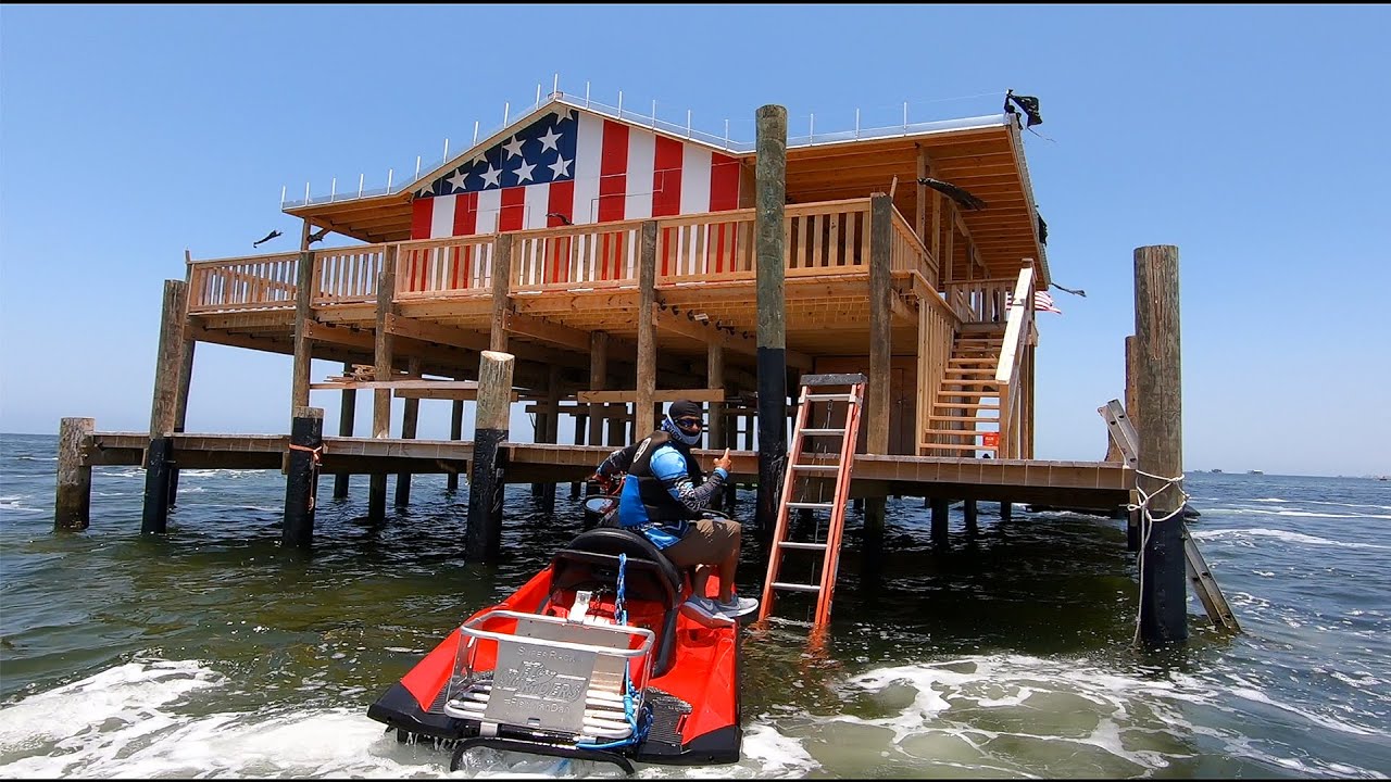 House On Stilts In Water A House On Stilts On A Body Of Water Photo