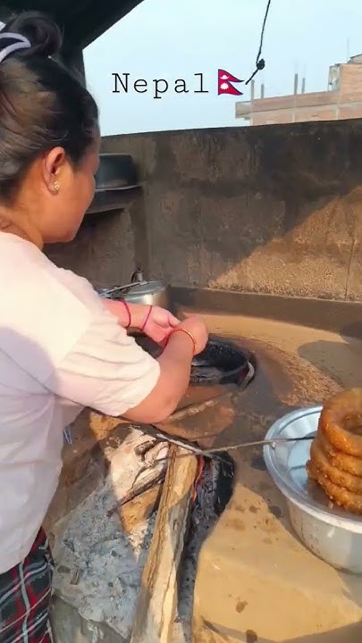 Sel roti is a traditional Nepalese ring-shaped sweet fried dough made from rice flour. # ...