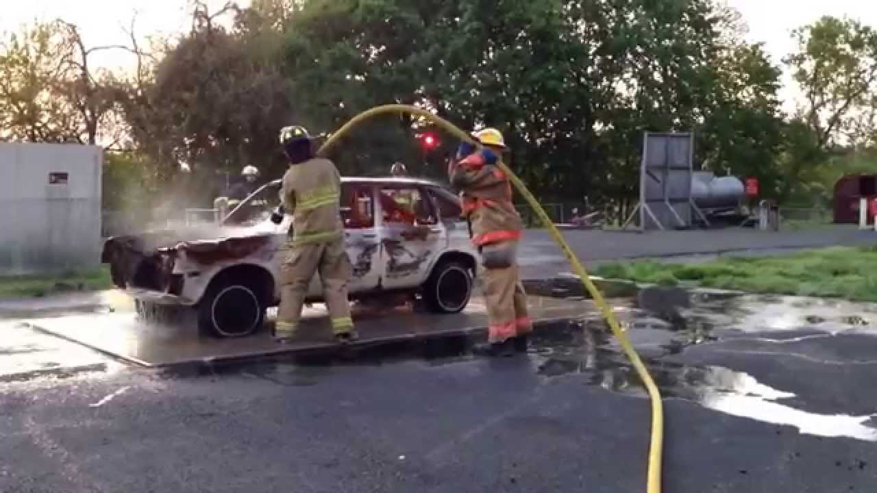 Putting out car fire with fire hose - YouTube