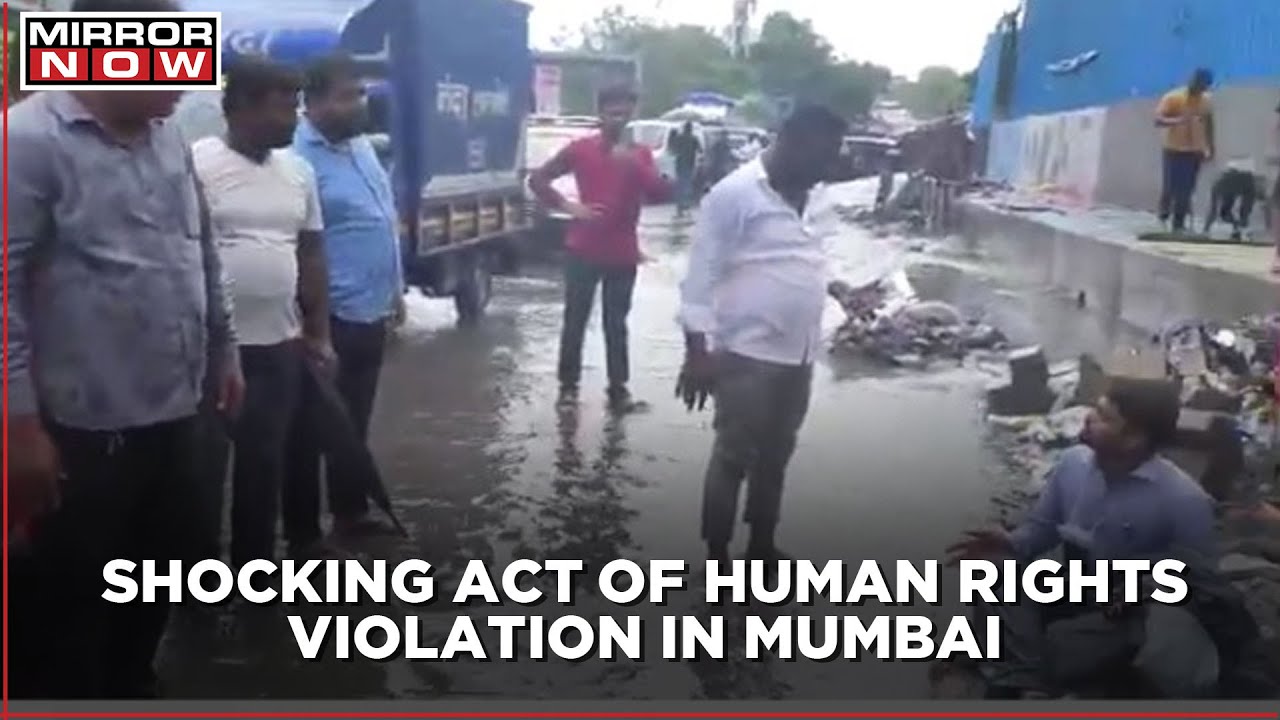 Mumbai: Shiv Sena MLA Dilip Lande forces a contractor to sit in a pile ...