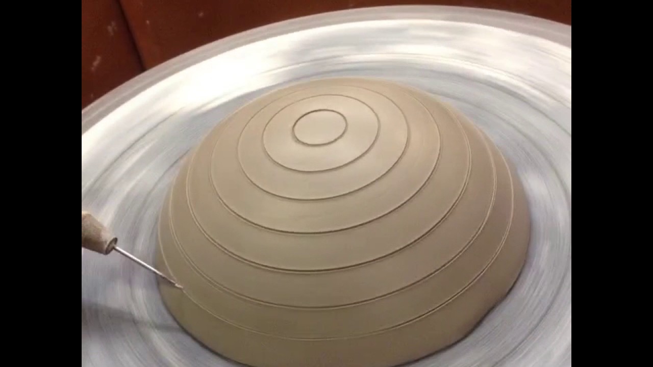 Drawing circles on a clay bowl - YouTube