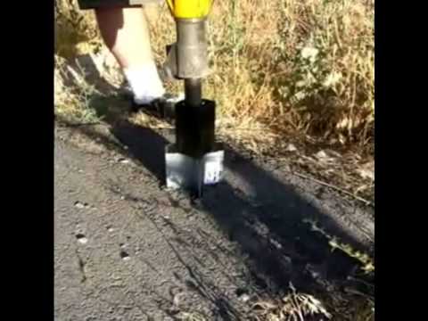 Installing fence posts through asphalt with the Oz Post - YouTube