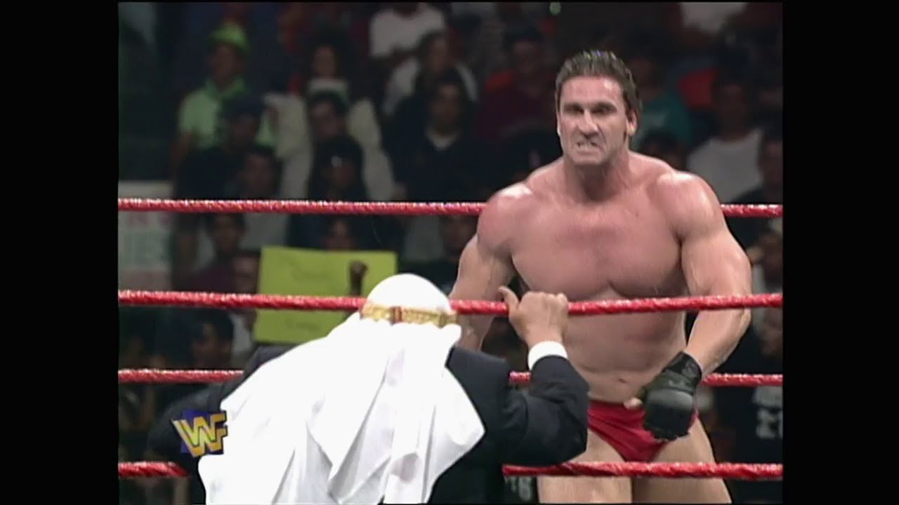 Iron Sheik Snaps Flag Pole over Ken Shamrock's Back during match with ...