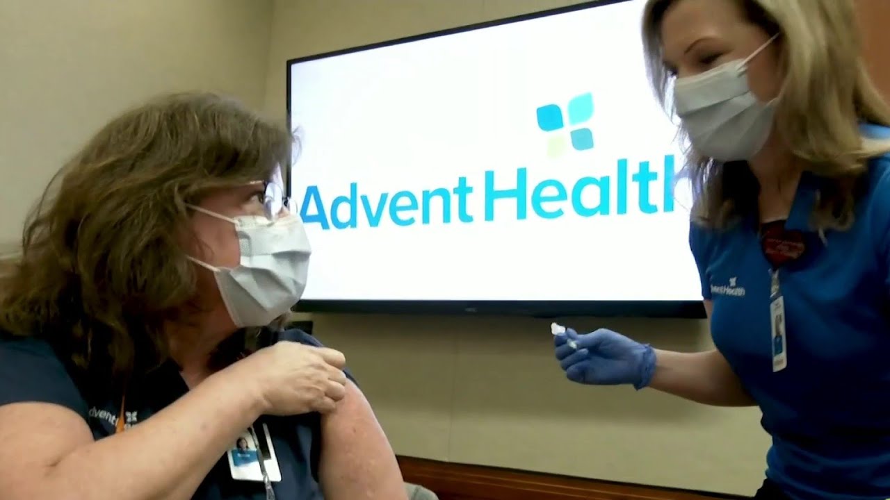 AdventHealth Orlando employees get first dose of Pfizer shot - YouTube