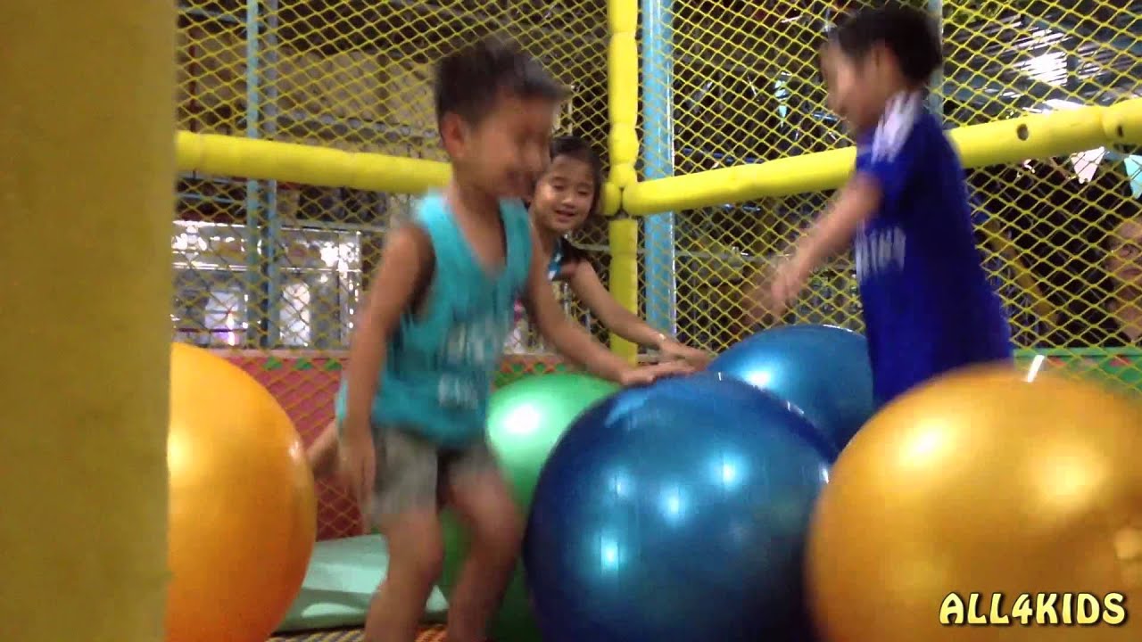 Kids playing in a trampoline with many big balls - YouTube