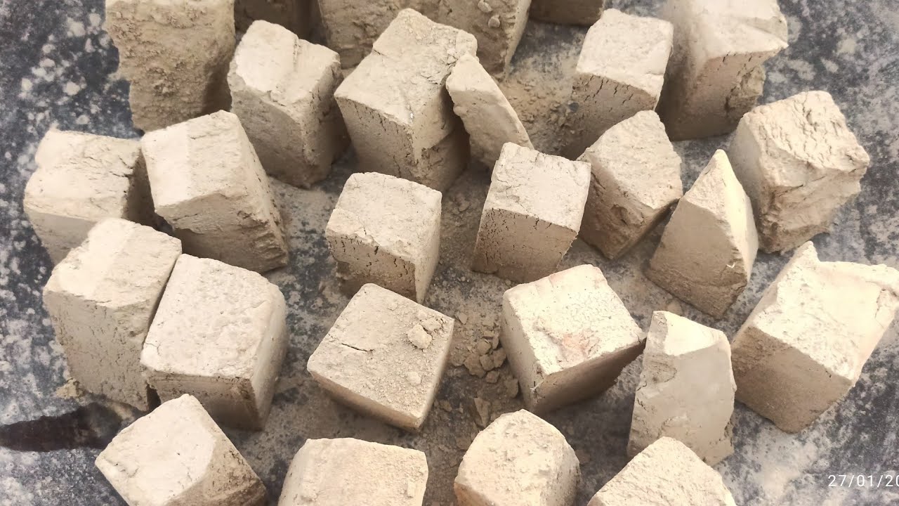 pure mud dirt cube shape dry crumbling dust soft and creamy texture ...