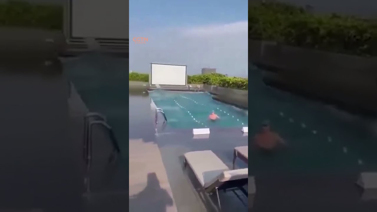 Swimmer stuck in rooftop pool during Taiwan quake - YouTube