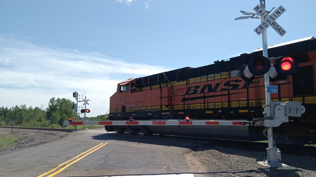 BNSF manifest train with BNSF #7744 and BNSF #6705 and a nice driver in ...