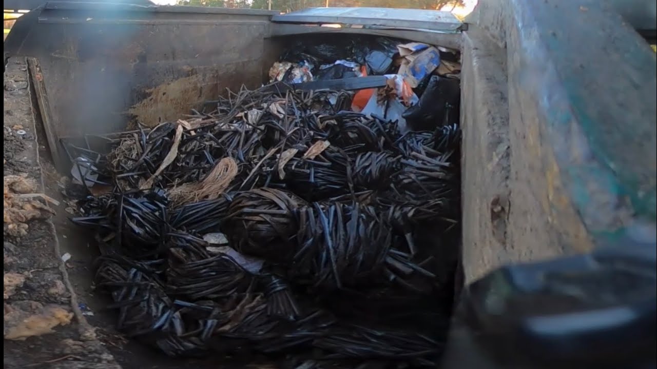 In body hopper view front load WM garbage truck dumping load at the end ...