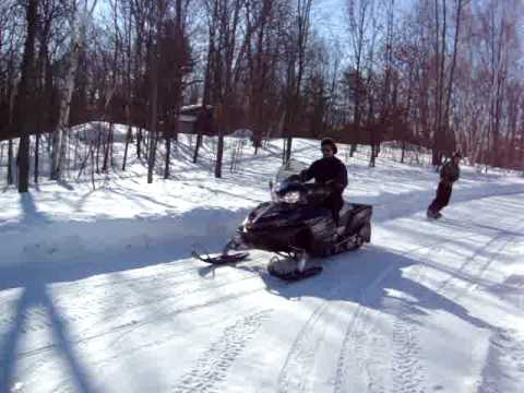Snowboarding behind a snowmobile - YouTube