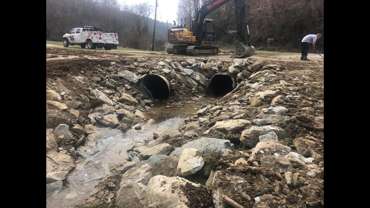 Working on clearing out culverts damaged by the floods. *Fwd to about ...