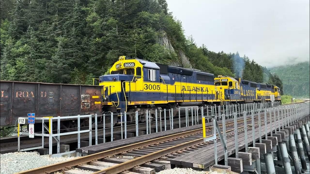 ARR 3002, ARR 2005, and ARR 3005 pull out of Whittier, Alaska, with 53 cars in tow towards ...