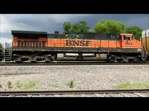 BNSF 5496 leads autorack train with a BNSF H1 scheme engine in Rochelle IL - YouTube
