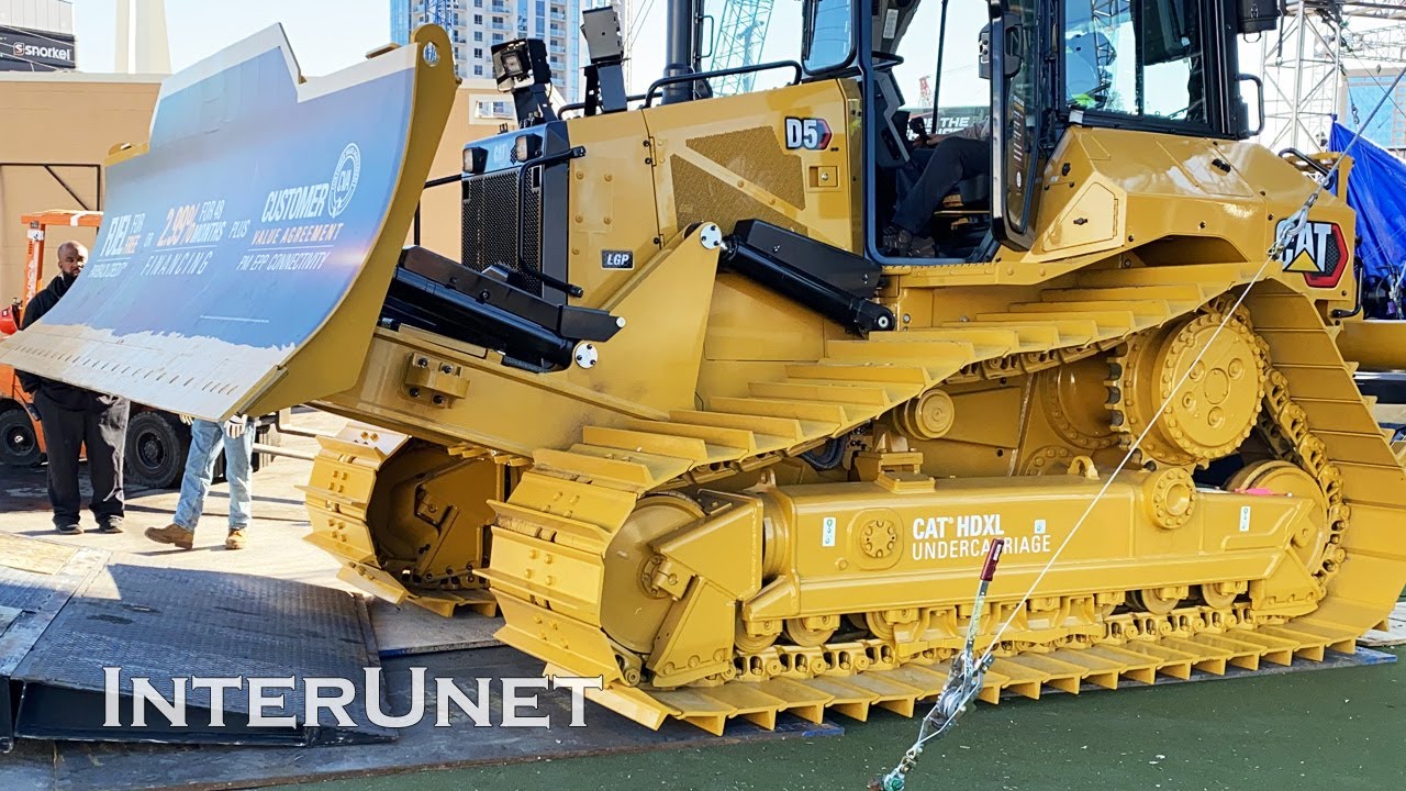 Loading New CAT D5 Dozer on Double Drop Semi Tractor Trailer CONEXPO ...