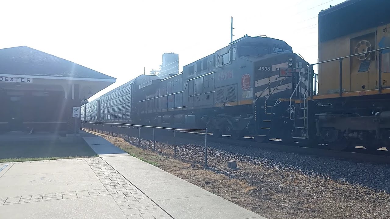 Union Pacific SD70m pulling a auto rack train with a KCS grey ghost and ...