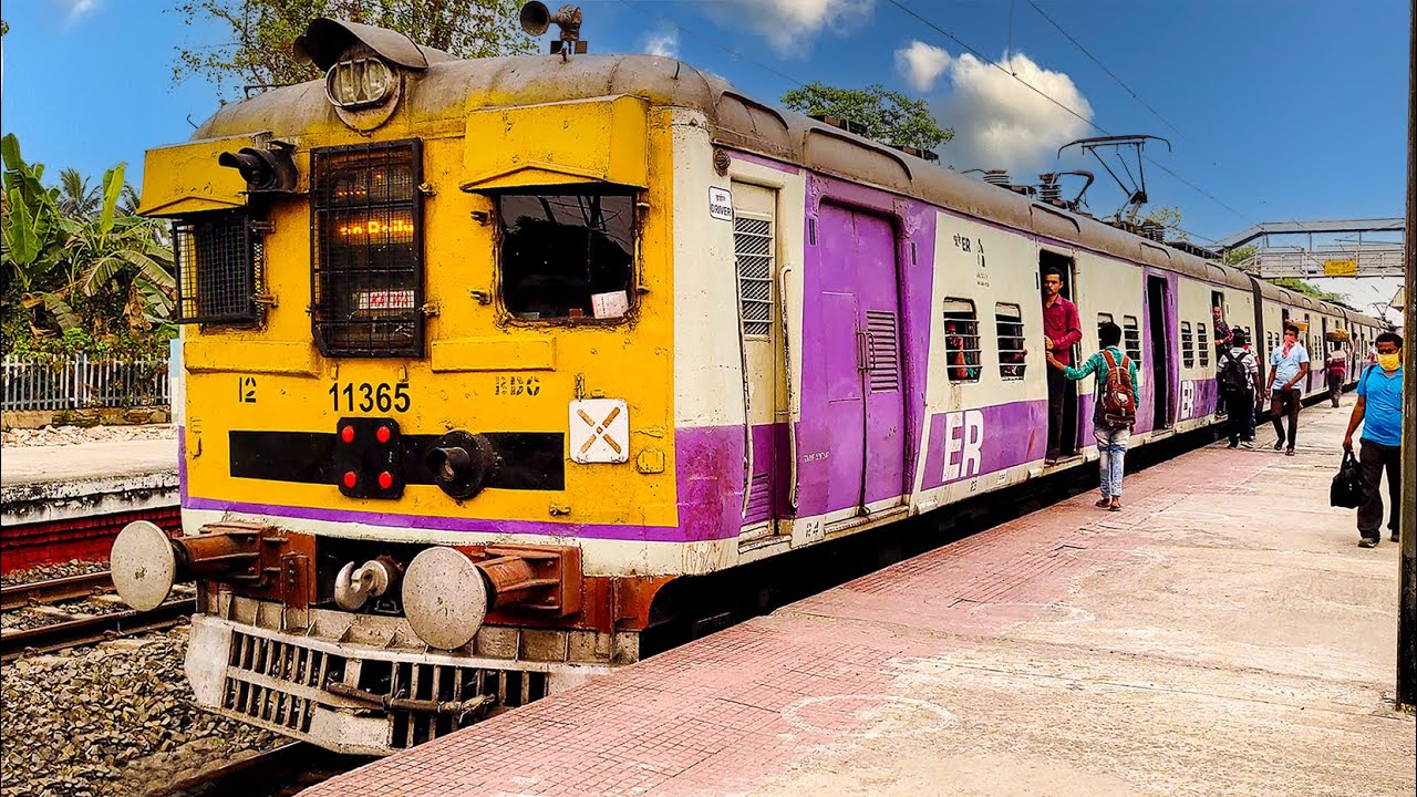 12 coach unit EMU local of Eastern Railway entering in a crowded ...