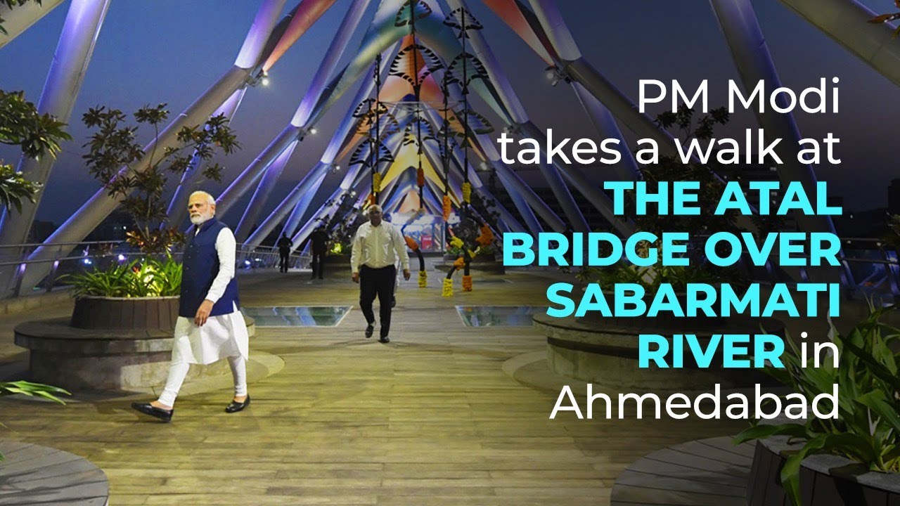 PM Modi takes a walk at the Atal Bridge over Sabarmati River in ...