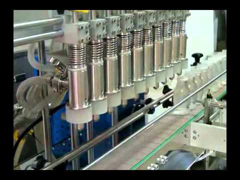 Multi-nozzle Overflow Liquid Filling Machine - YouTube