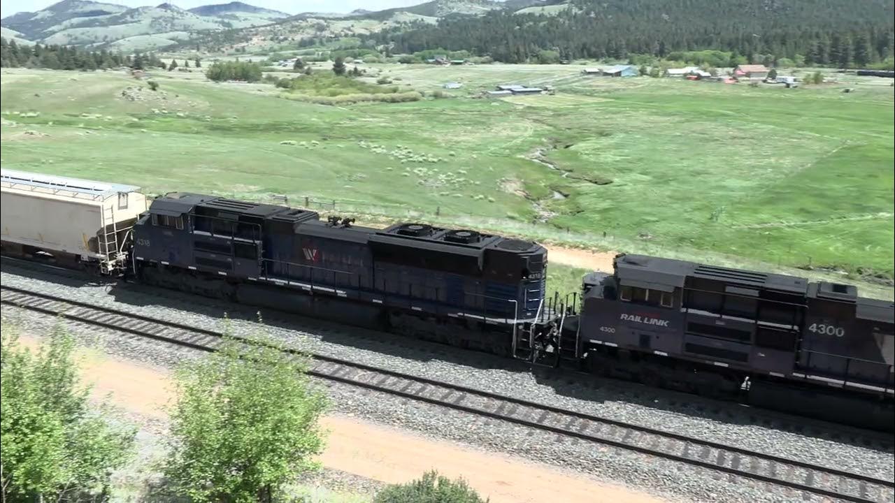 BNSF Manifest with Heavy transformer load and mid-train helper set passes Austin, Mullan Pass MT ...