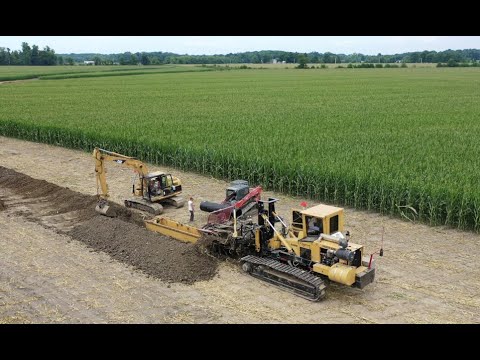 Field Drainage - Installing a Catch Basin and Main County Drain with CSI - YouTube