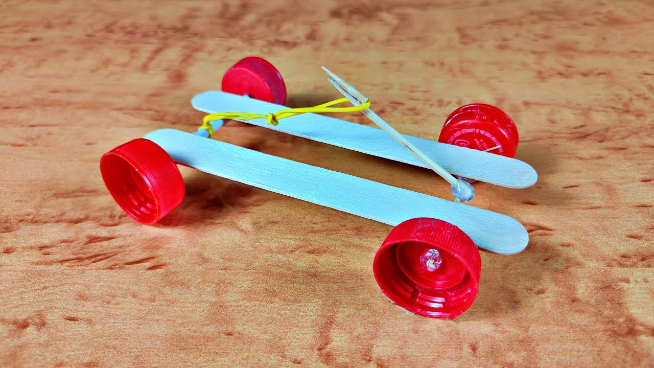 How to make a mini rubber band powered car - Simple toy car - YouTube