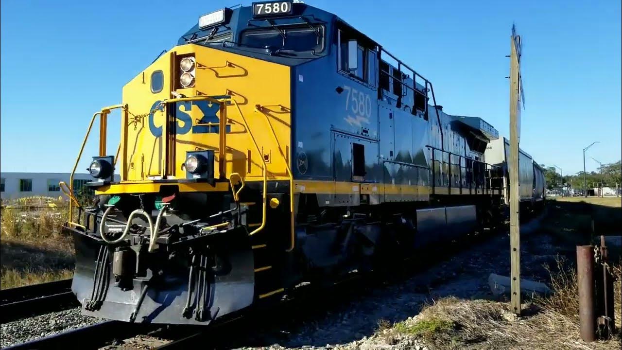 Spotless! CSX #7580 on its Maiden (First) Journey leading the M453 at the Lakeland Junction ...