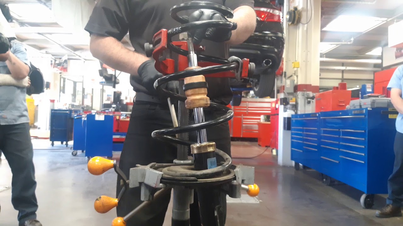 How to disassemble and reassemble a strut on machine - YouTube
