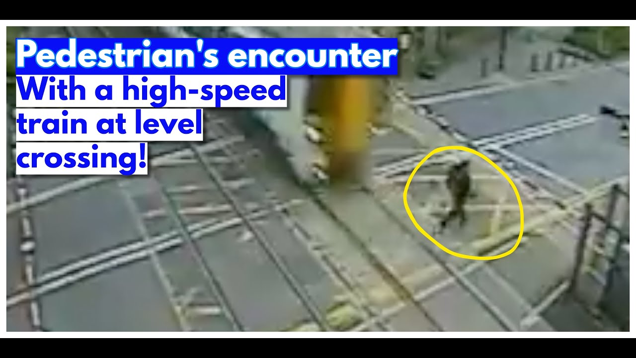 Pedestrian Hops Railway Crossing And Comes Within INCHES Of High-Speed ...