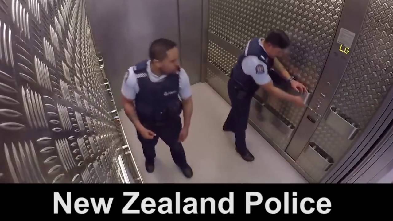 Police officers dancing in elevator (musical) - YouTube