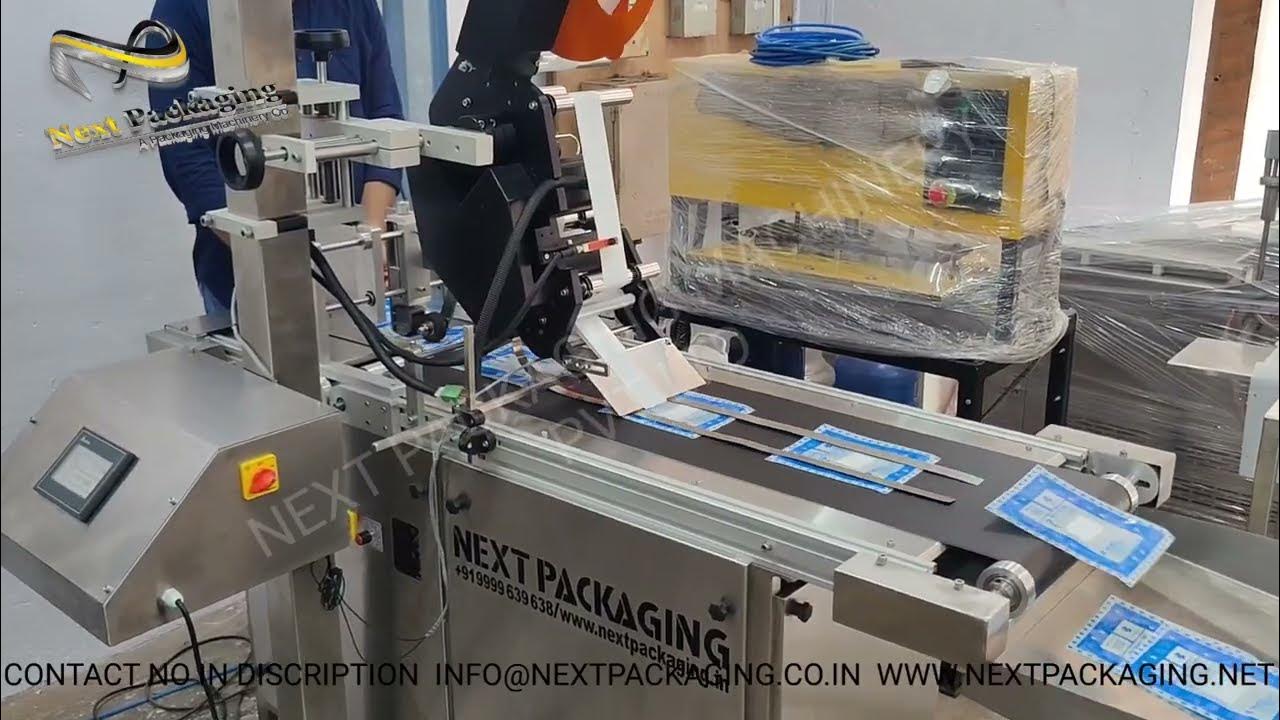 Automatic sticker labeling machine on mono cartons | friction feeder ...