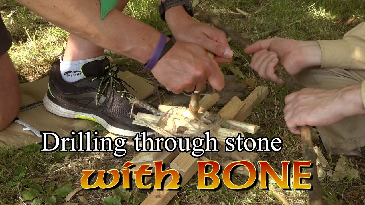 Drilling through a stone with stone-age technology - YouTube