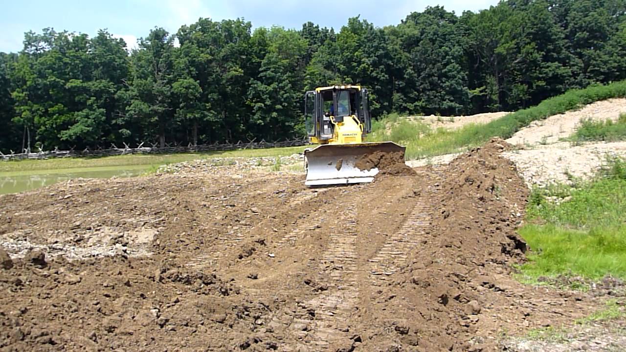 Bulldozer Pushing Topsoil - YouTube