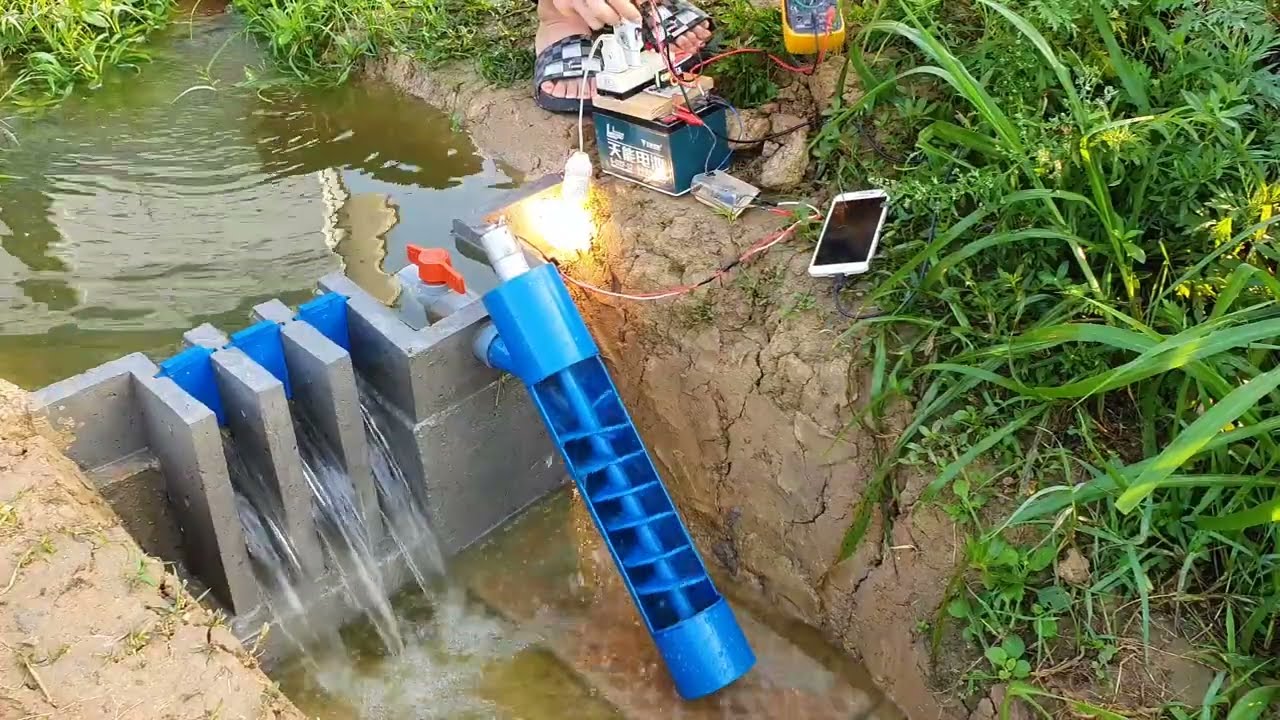 The mini hydroelectric dam on the water canal generates electricity for ...