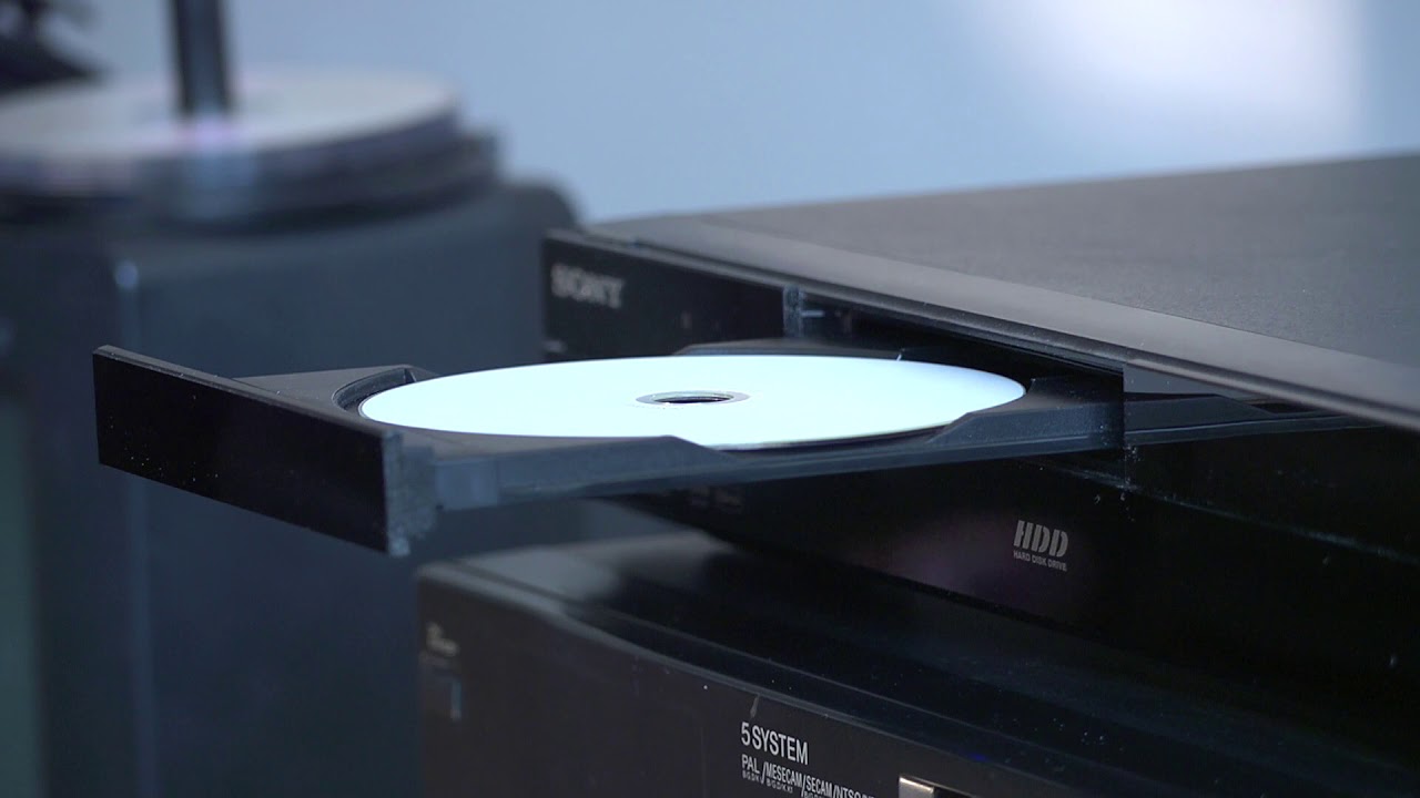 Inserting a DVD into tray of a DVD player and closing it. Free HD video ...