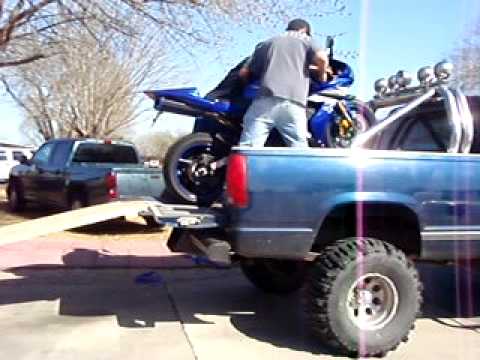 Unloading a motorcycle with a homemade ramp - YouTube