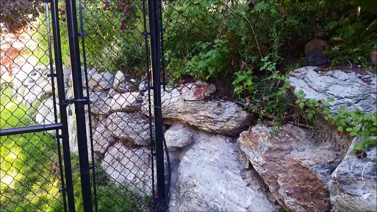 How to put a fence over a retaining wall - YouTube